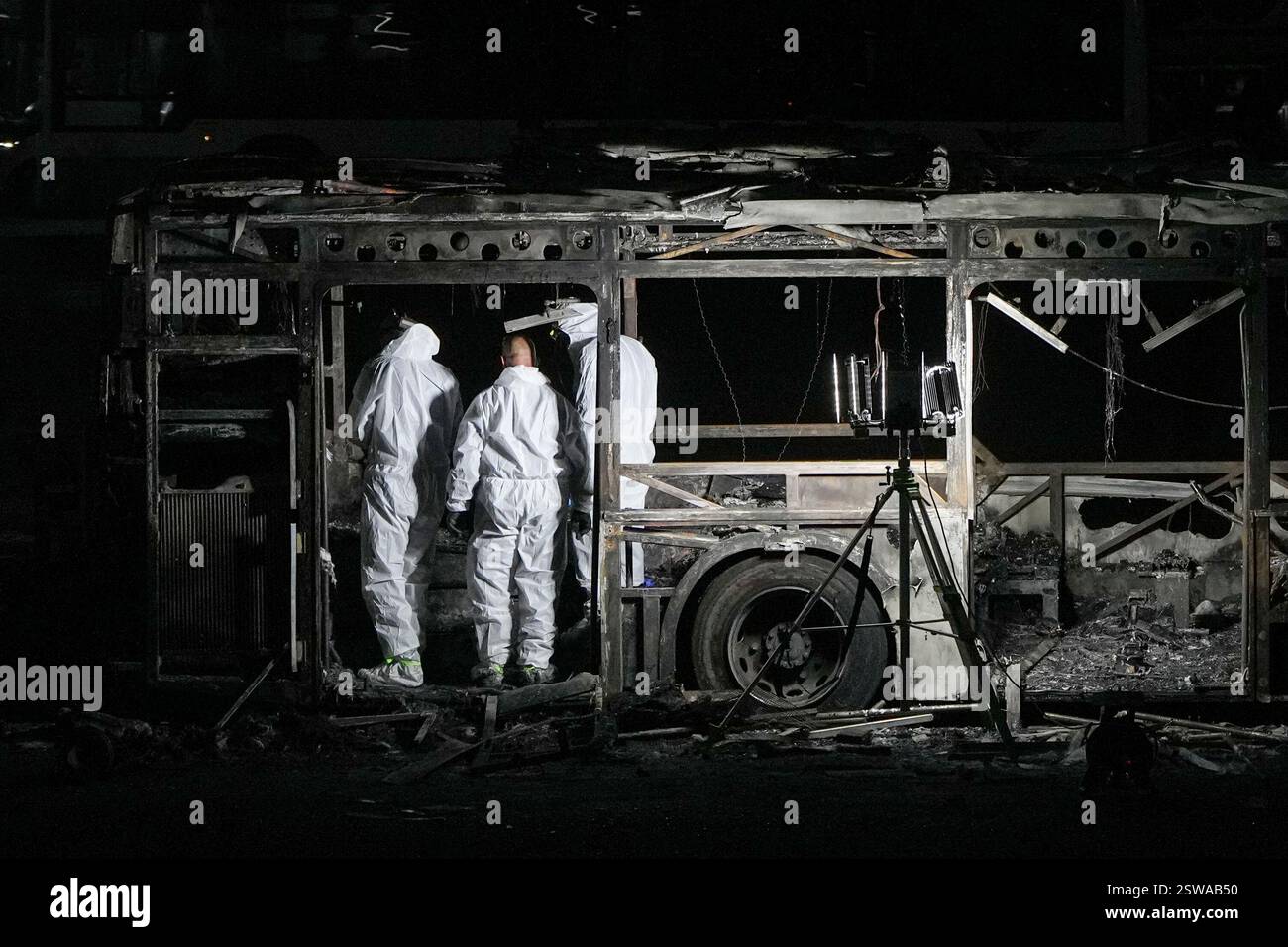 Israeli police inspect the scene of one of a series of bus explosions ...