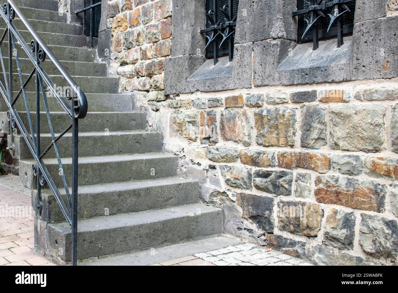 Stone old steps in ancient famous castle in the city. Landscape with ...