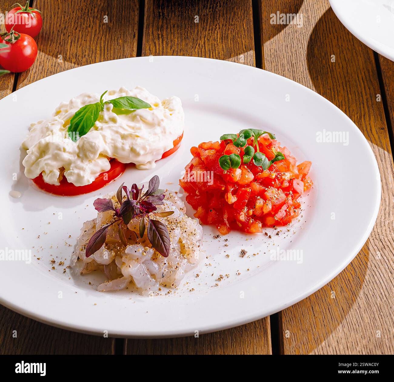 Gourmet tomato and cheese appetizers on elegant table setting Stock ...