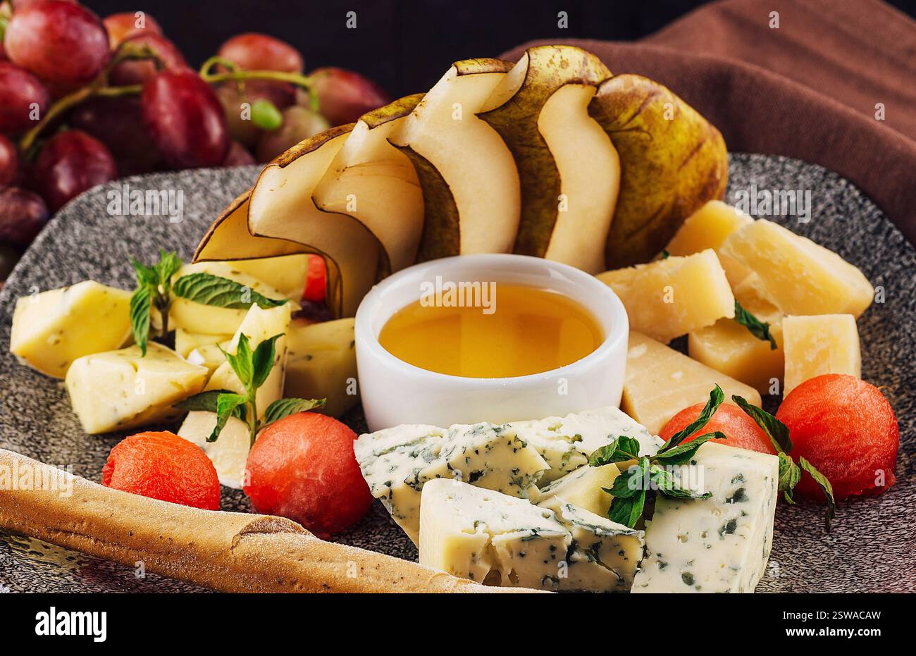 Gourmet cheese plate offering variety of textures and flavors with ...