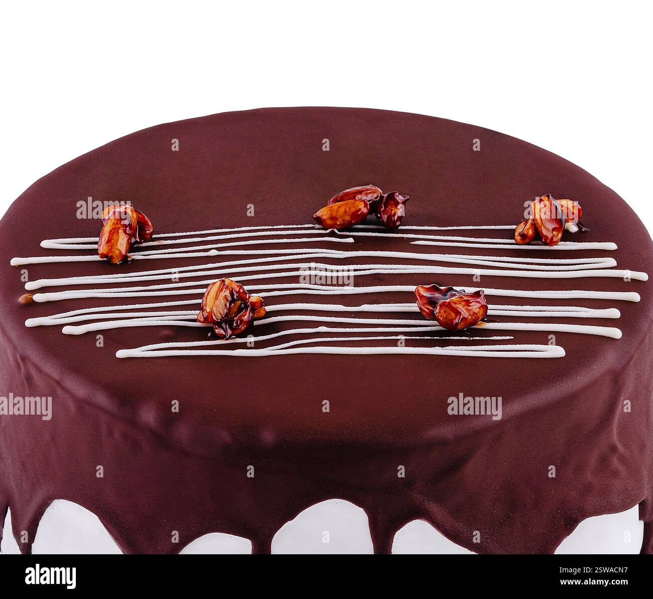 Chocolate cake with nuts dripping icing on white background Stock Photo ...