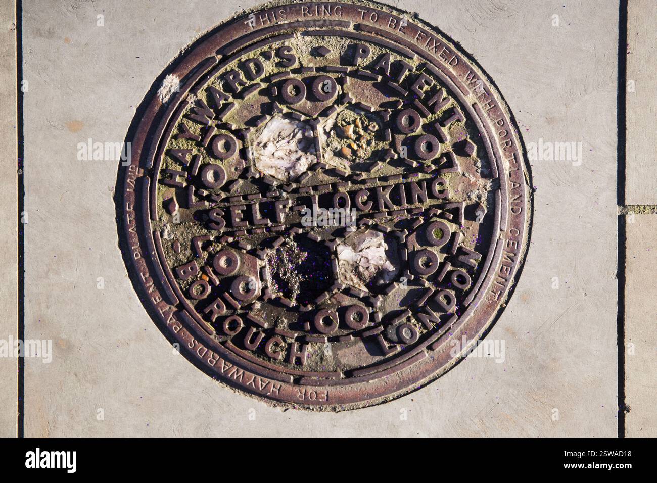 Manhole cover, patent self-locking Stock Photo - Alamy