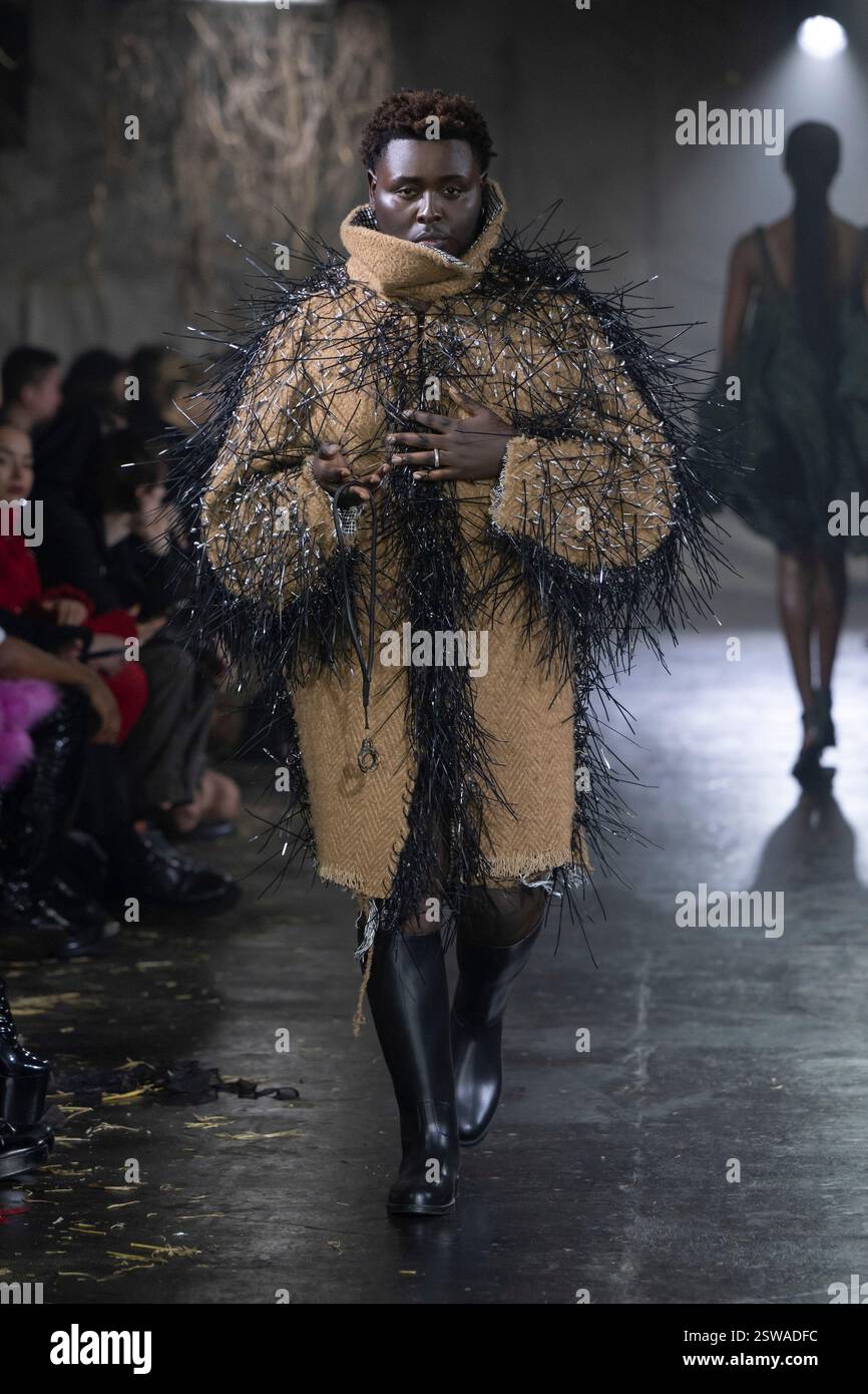London, UK. 20th Feb, 2025. A model walks on the runway during the ...