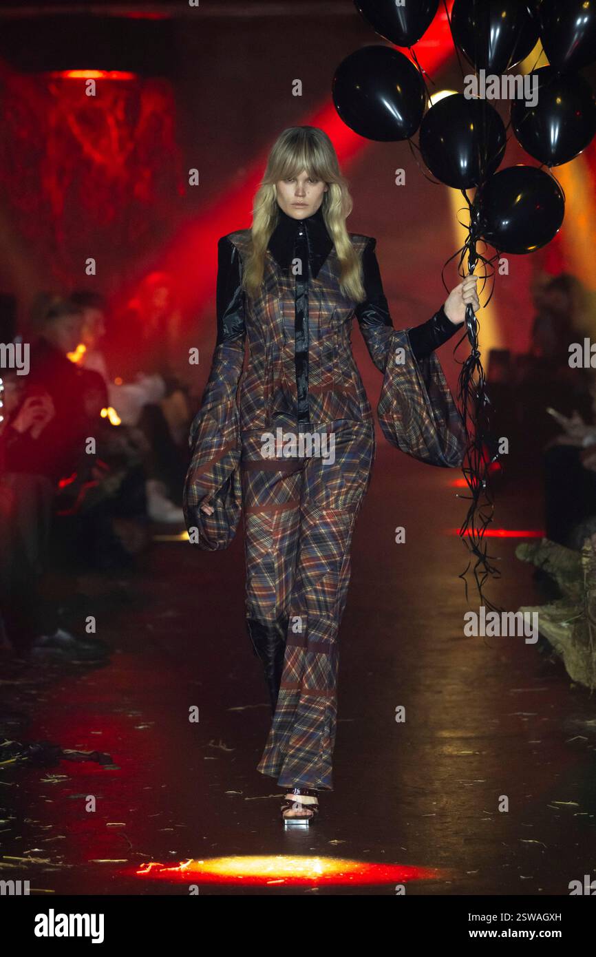 London, UK. 20th Feb, 2025. A model walks on the runway during the ...