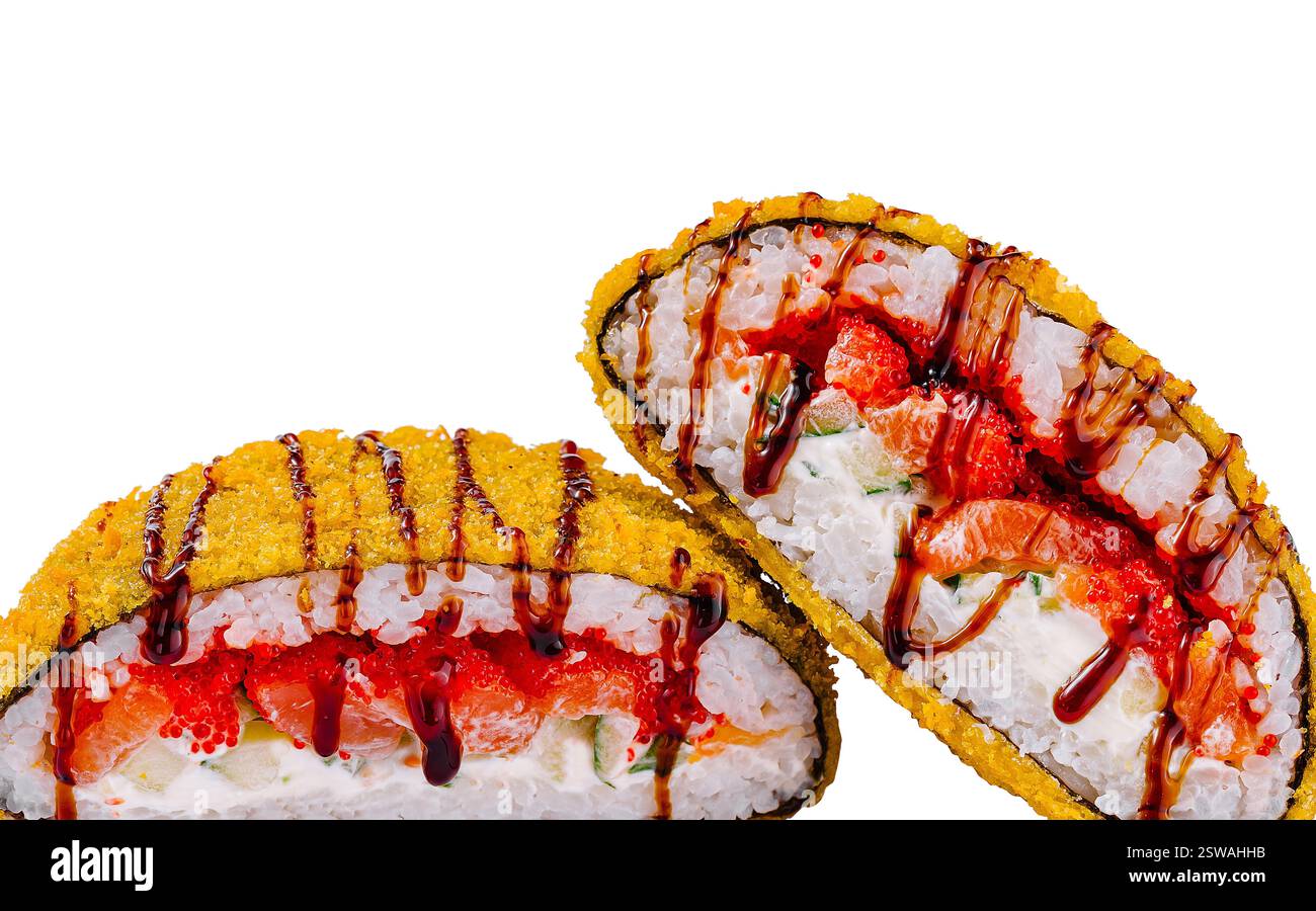 Two sushi rolls covered in panko breading with soy sauce drizzled on ...