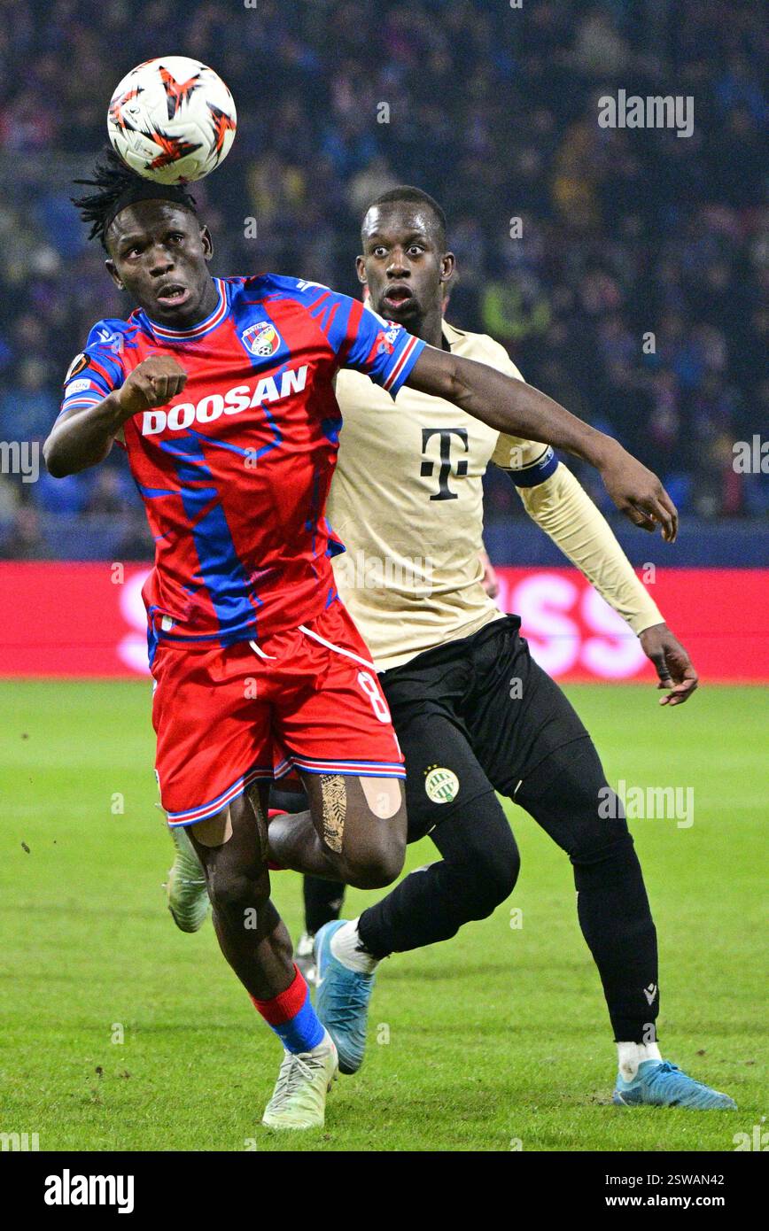 L-R Prince Adu (Plzen) and Ibrahim Cisse (Ferencvaros) in action during ...
