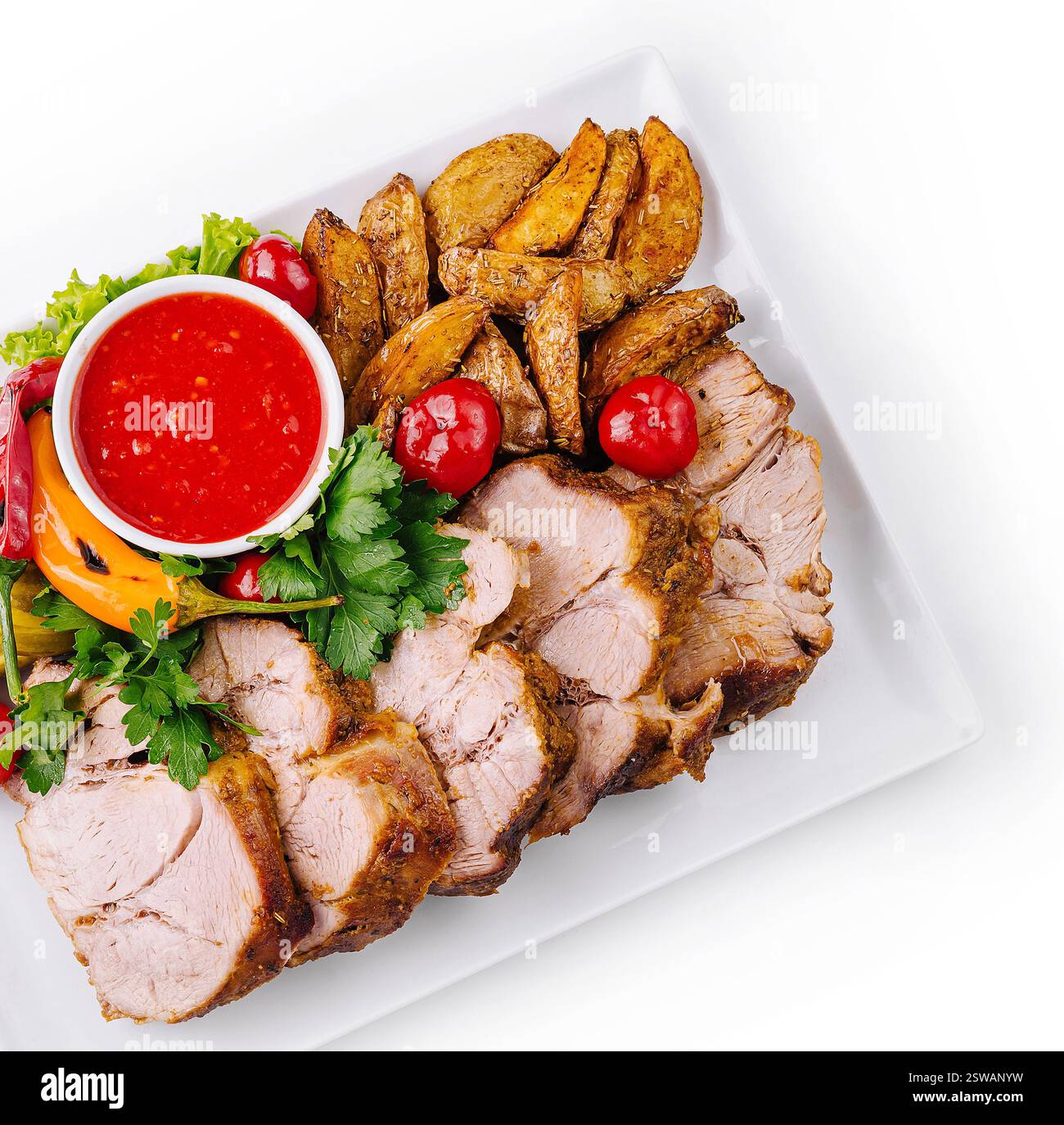 Roasted pork platter with side dishes Stock Photo - Alamy