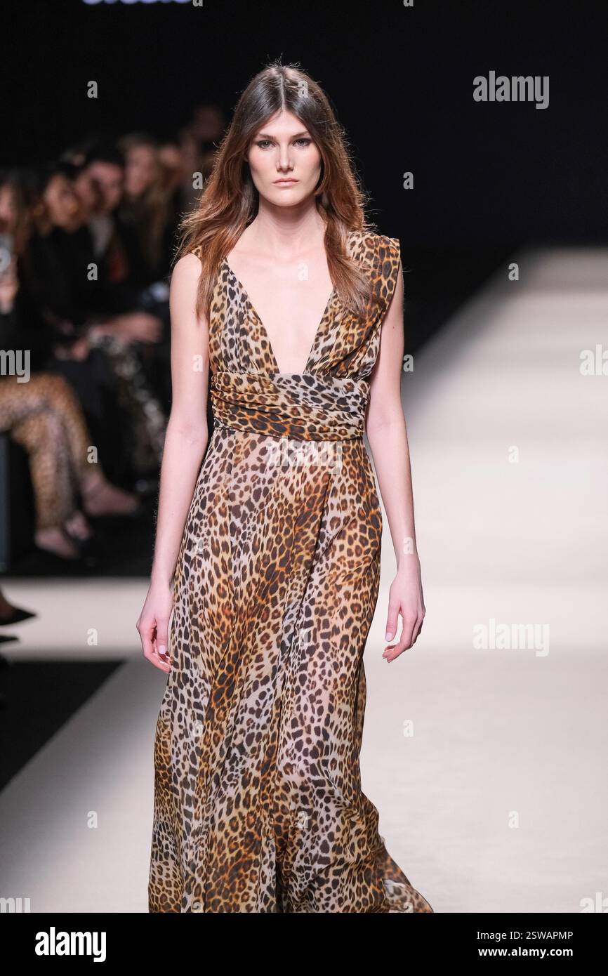 A model walks the runway wearing a design by Alex Riviere during ...