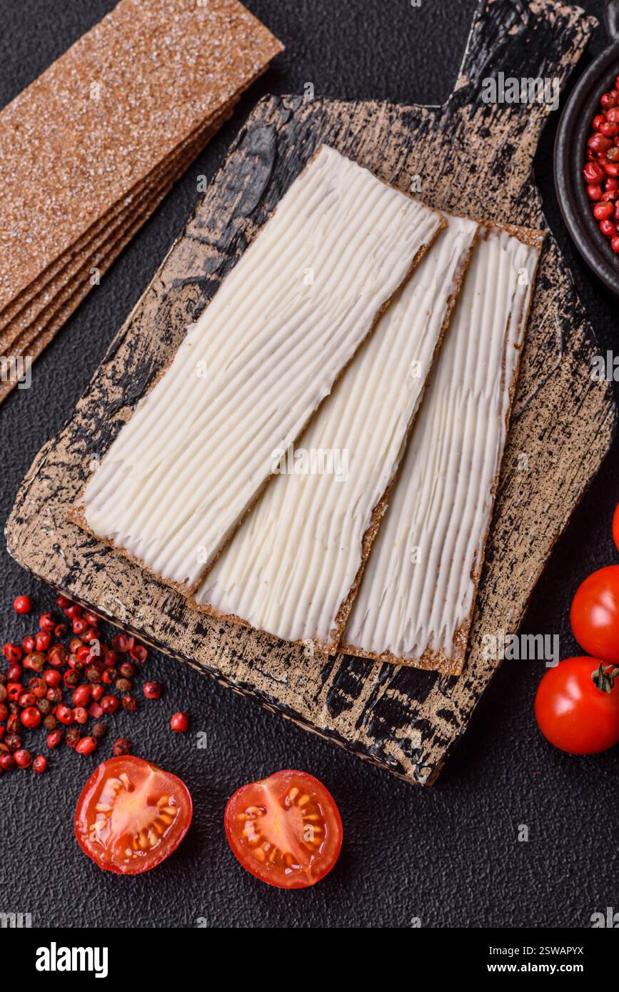 Rectangular whole grain crisp bread with cream cheese for hearty hi-res ...
