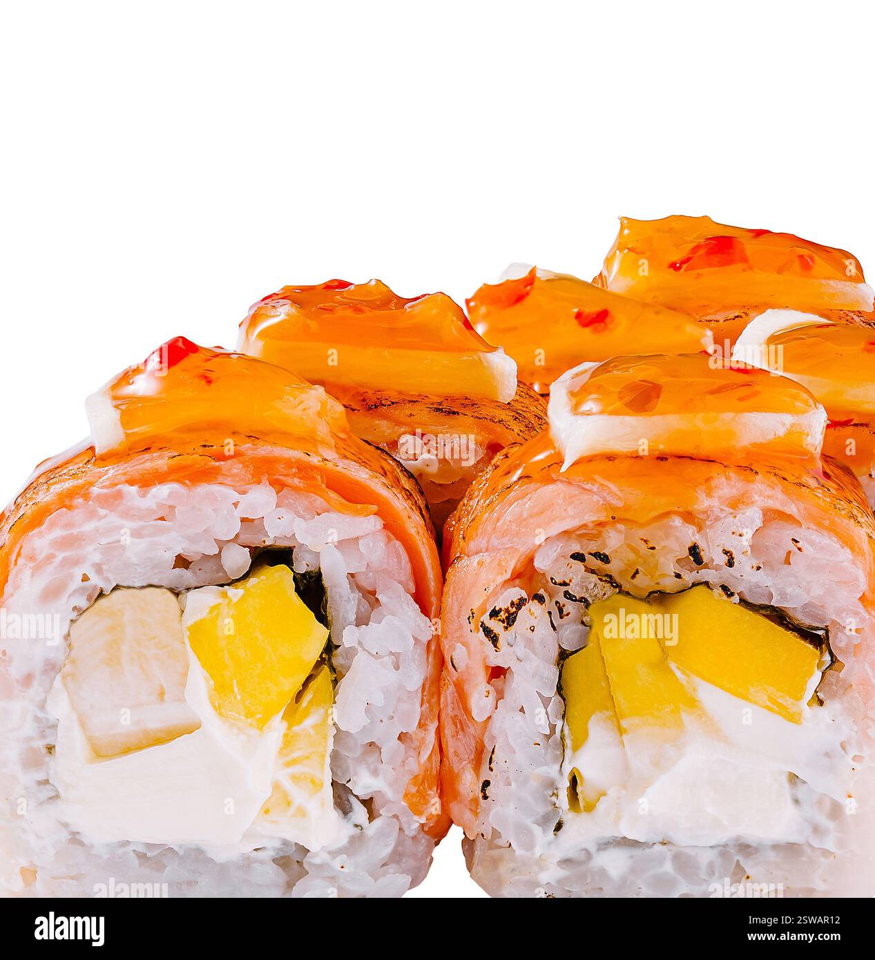 Sushi rolls with salmon, mango and cream cheese covered with sauce ...