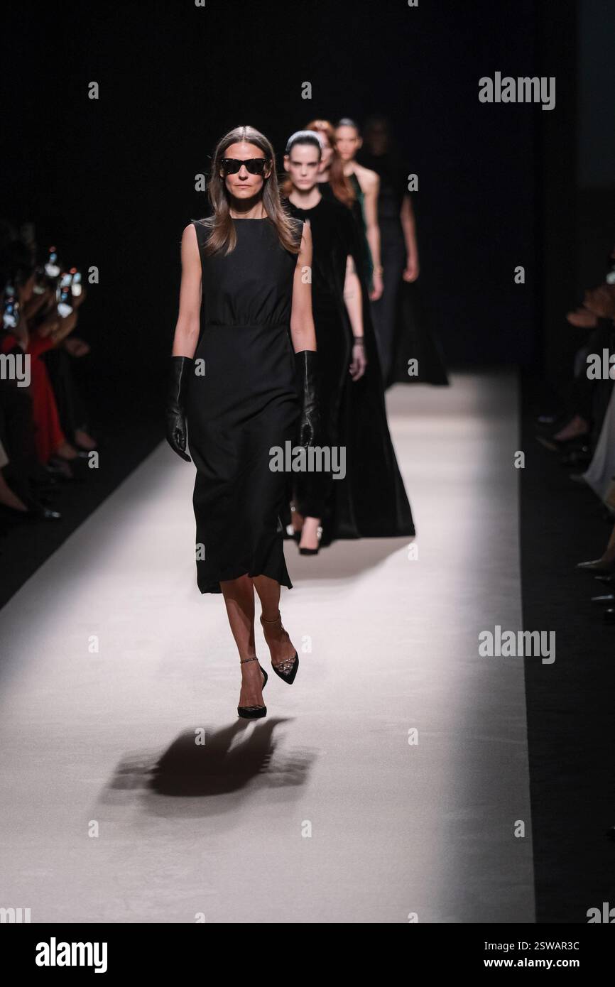 A model walks the runway wearing a design by Alex Riviere during ...