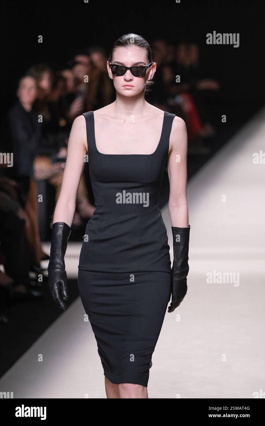 A model walks the runway wearing a design by Alex Riviere during ...