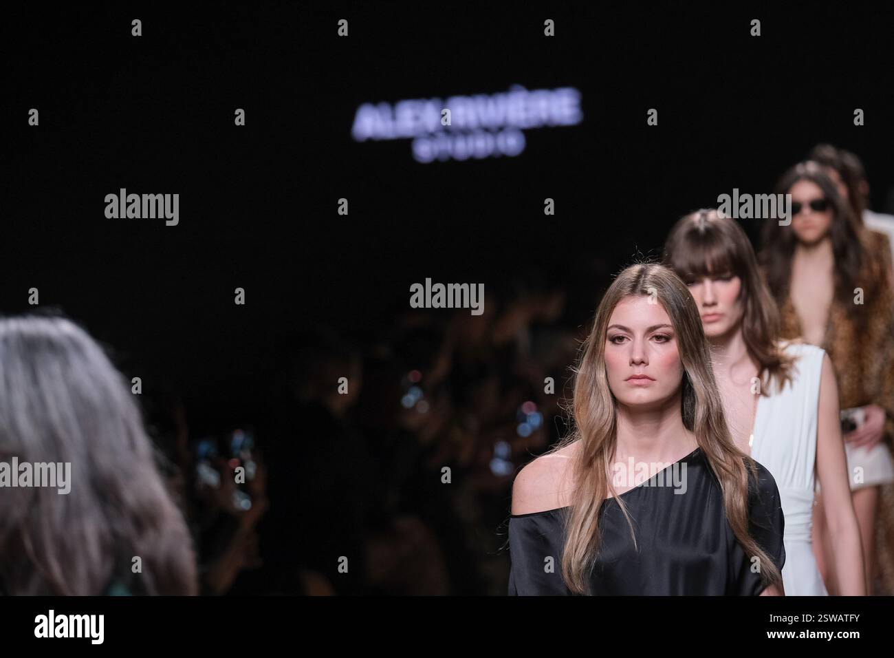 A model walks the runway wearing a design by Alex Riviere during ...