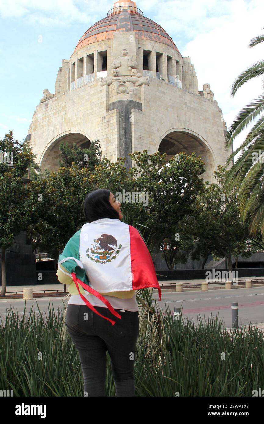 Latina adult woman shows the flag of Mexico with pride to celebrate the ...