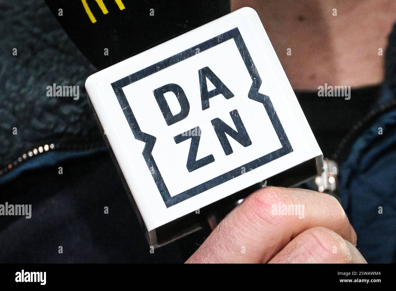 Illustration of the microphone with the official logo of DAZN during ...