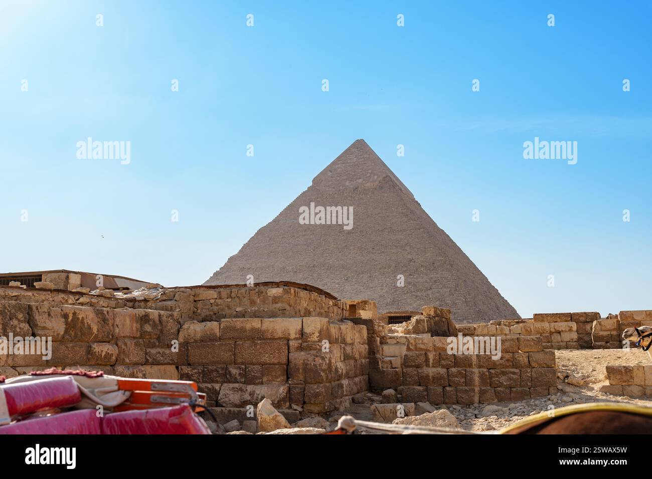 Majestic pyramid rises against clear sky in ancient Egyptian landscape ...