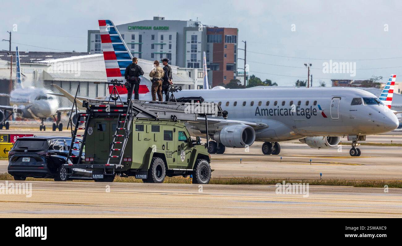 Secret Service snipers are seen positioned on the tarmac ahead of the ...
