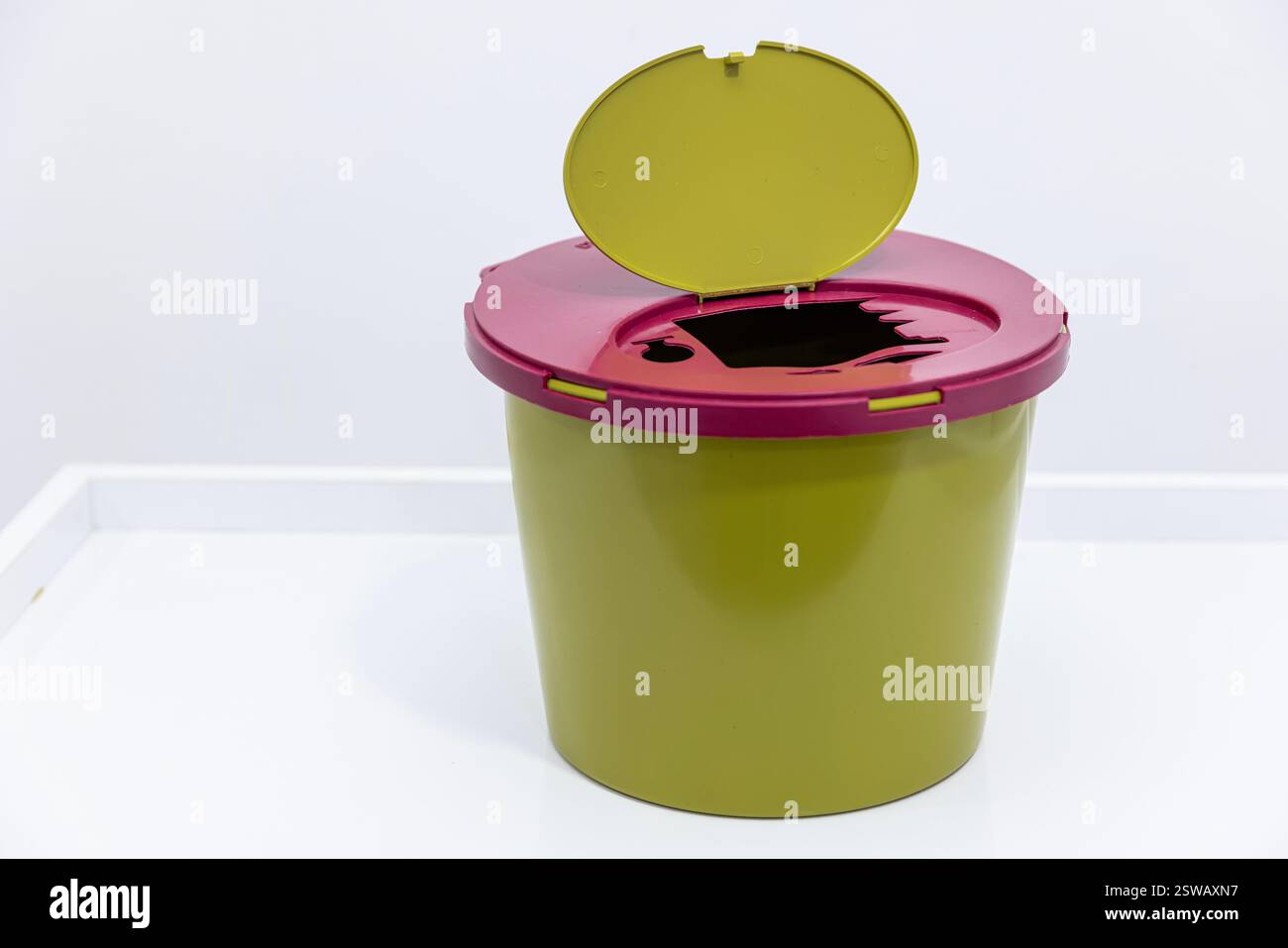 Plastic containers for medical waste disposal on white background ...