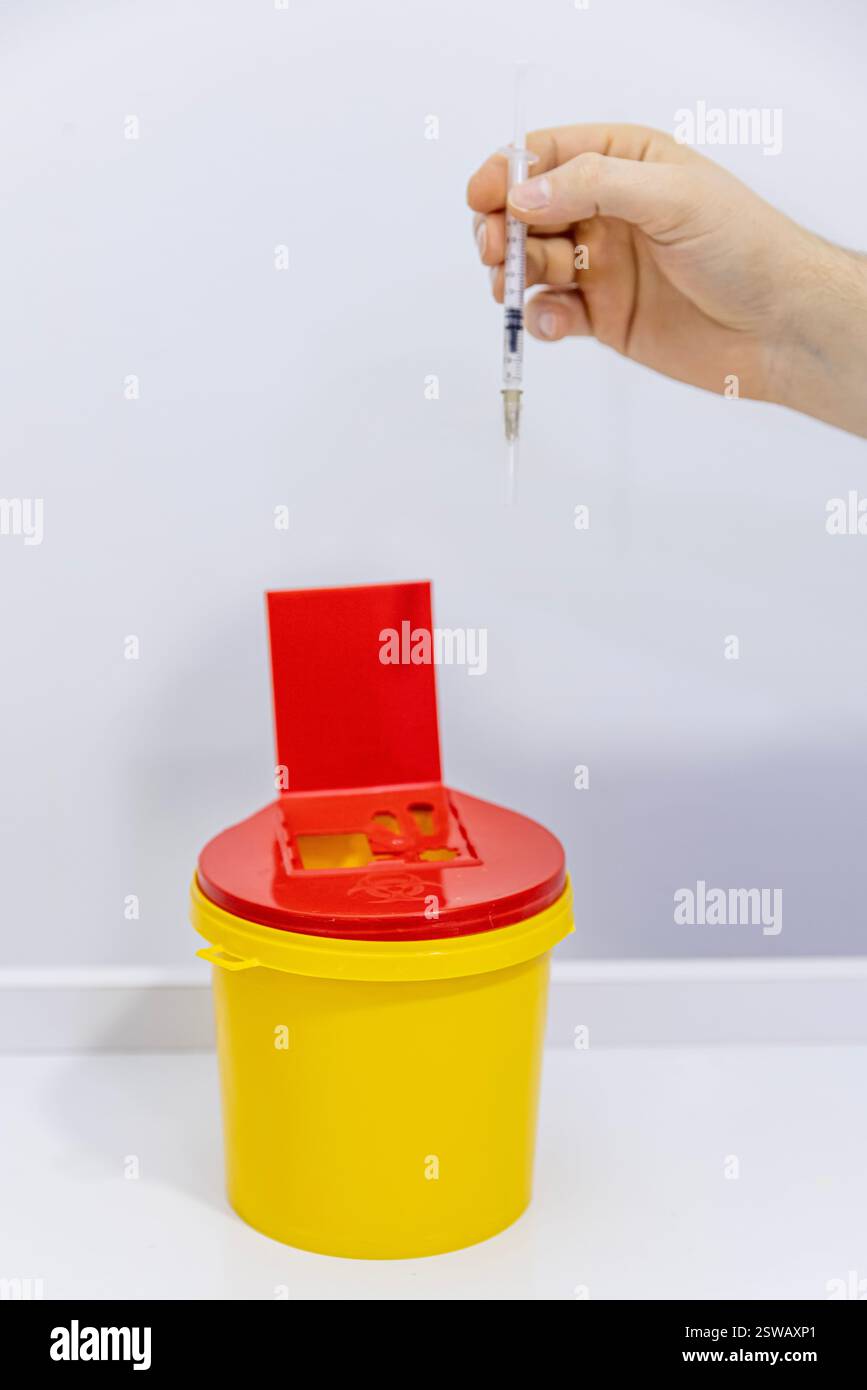 Plastic containers for medical waste disposal on white background ...