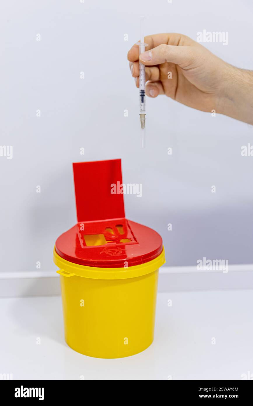Plastic containers for medical waste disposal on white background ...