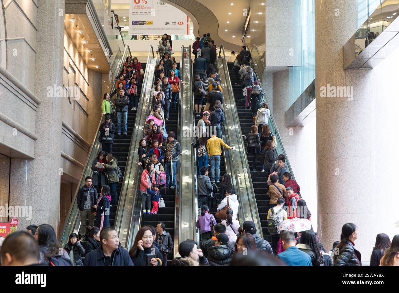 Crowds use escalators in a Hong Kong Times Square, Causeway Bay Stock ...
