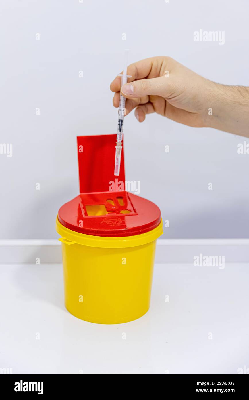 Plastic containers for medical waste disposal on white background ...