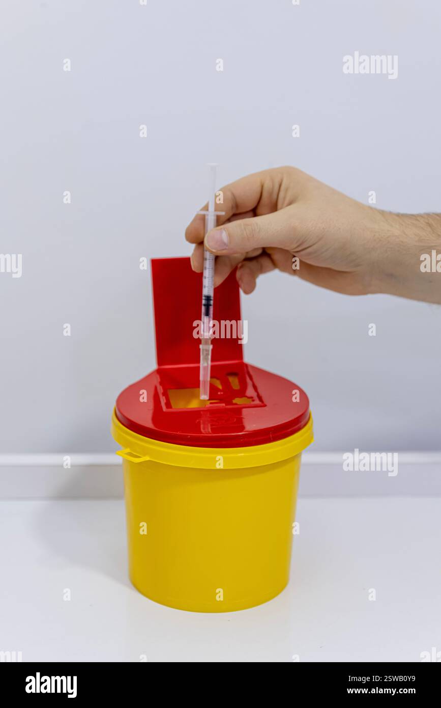 Plastic containers for medical waste disposal on white background ...