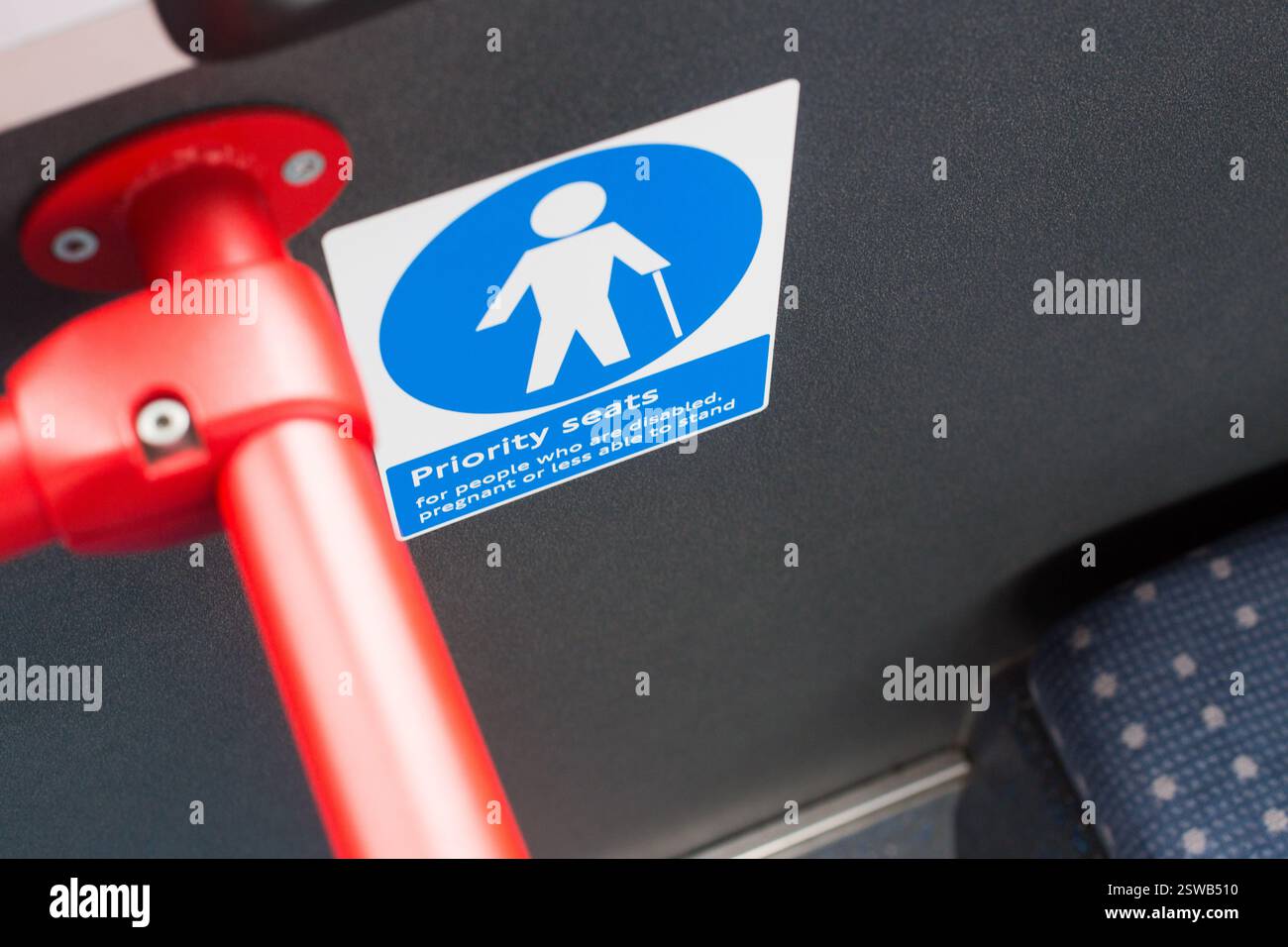 Priority seats for pregnant or disabled people on a London bus Stock ...