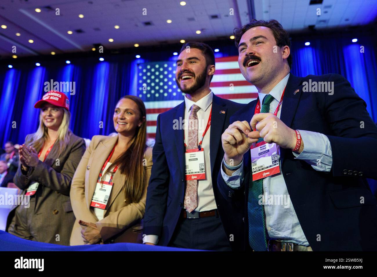 Attendees watch as US Vice President JD Vance speaks with Mercedes ...
