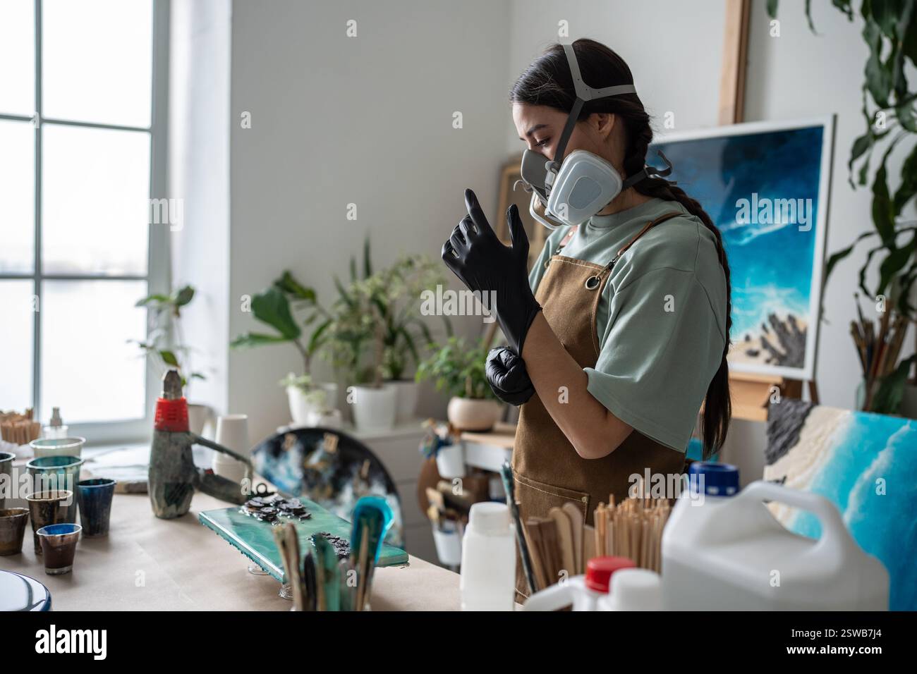 Female artist concentrates, enters state of focus, preparing for hard ...