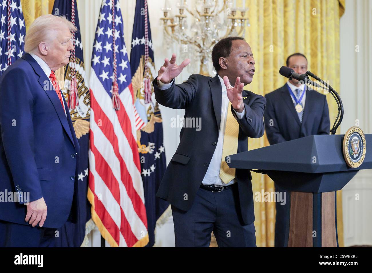 Attorney Leo James Terrell (C) speaks while standing with US President ...