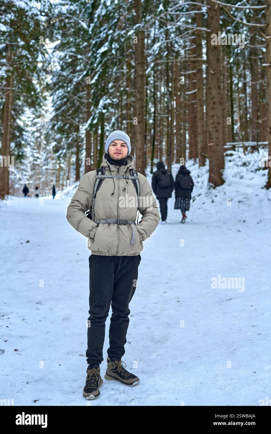 Winter Wonderland Adventure Young Man Hiking Snow Covered Forest Path Surrounded by Towering ...