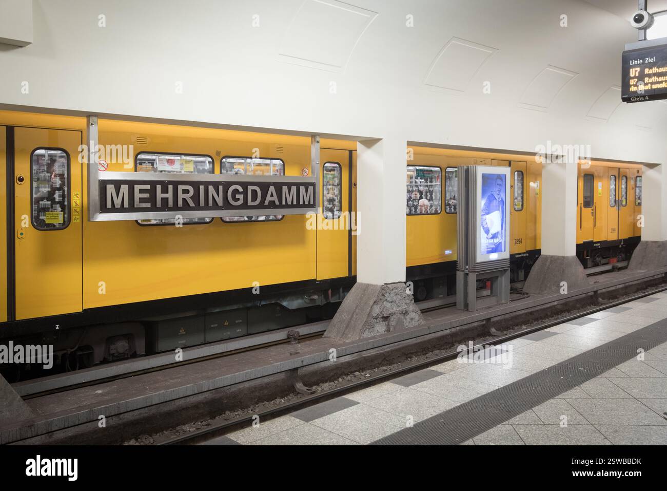 Yellow Berlin U-Bahn train at Mehringdamm station, platform 4. U7 line ...