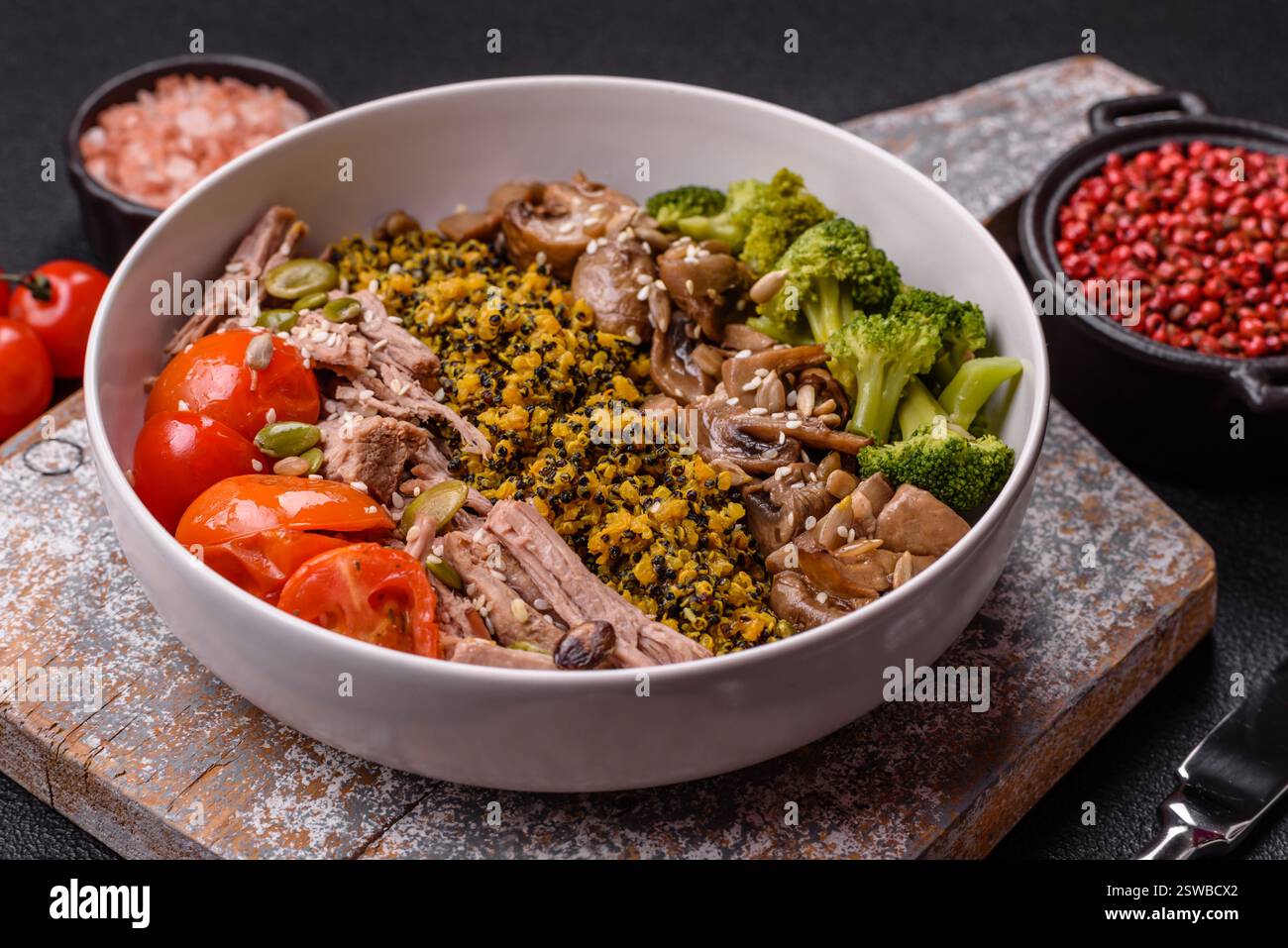 Quinoa bowl with tofu, steamed vegetables, grains, seeds and spices ...