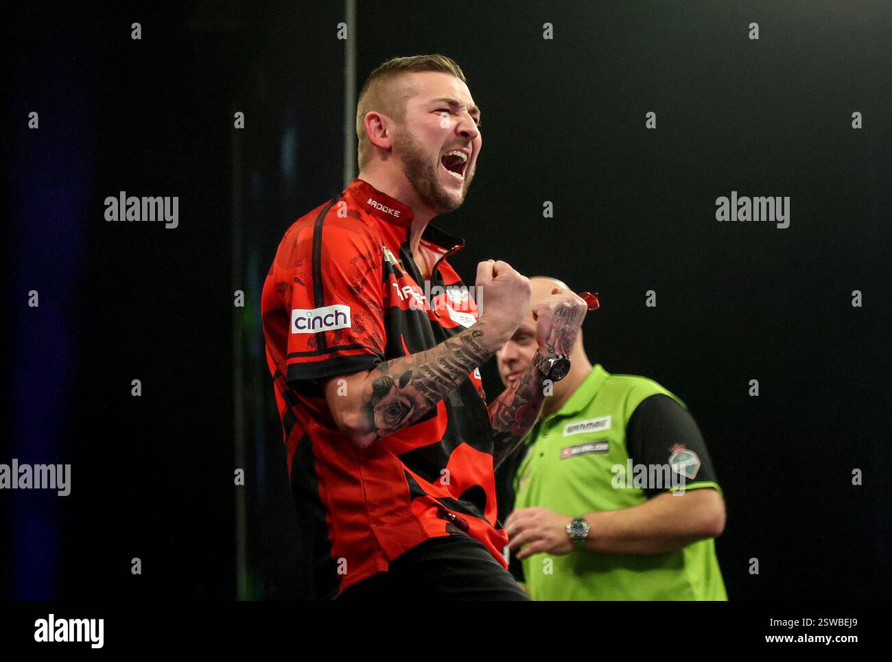 Nathan Aspinall celebrates winning his match against Michael van Gerwen ...