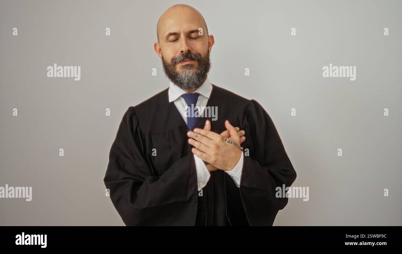Handsome hispanic man with a beard standing with hands on heart over an ...