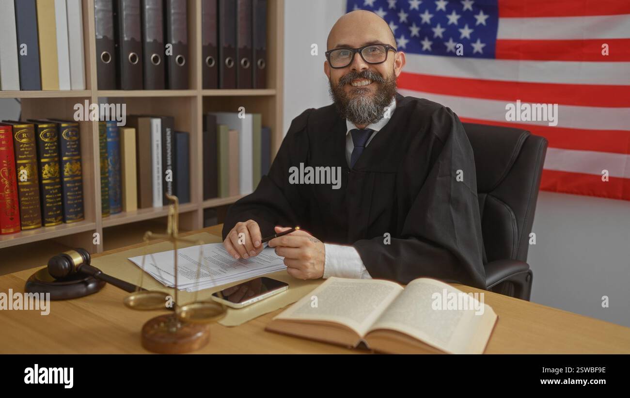 Hispanic man in judge's robe sitting in a courtroom office, with a ...