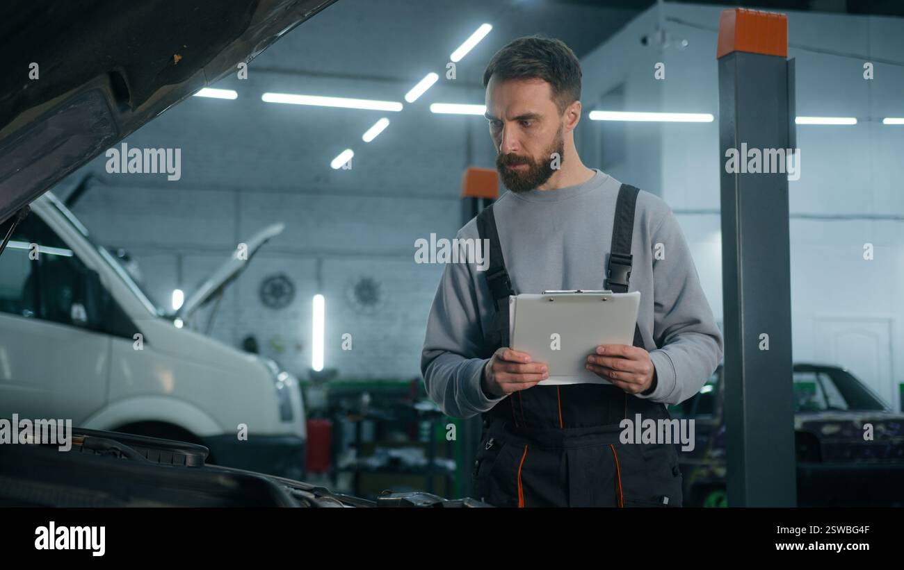 Auto mechanic professional technical expert Caucasian man male checking ...