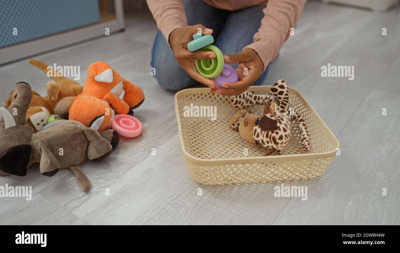 Woman sorting colorful toys in bedroom with wooden floor and stuffed ...