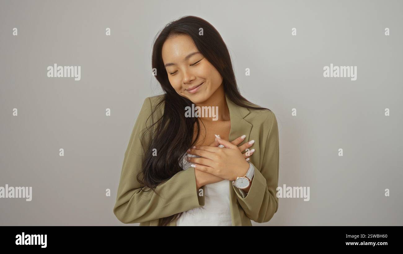 Beautiful young chinese woman isolated against a white background with ...
