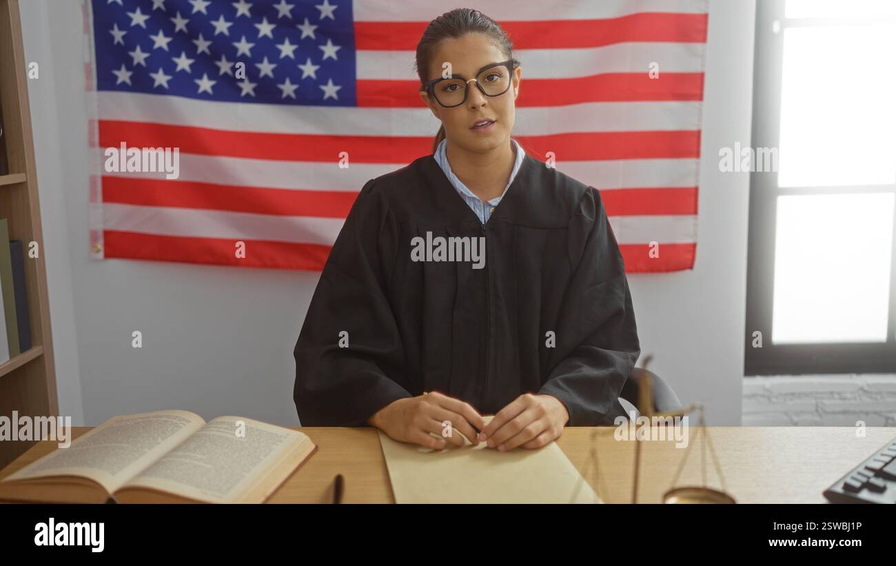 Woman judge sitting in a courtroom wearing glasses with an american ...