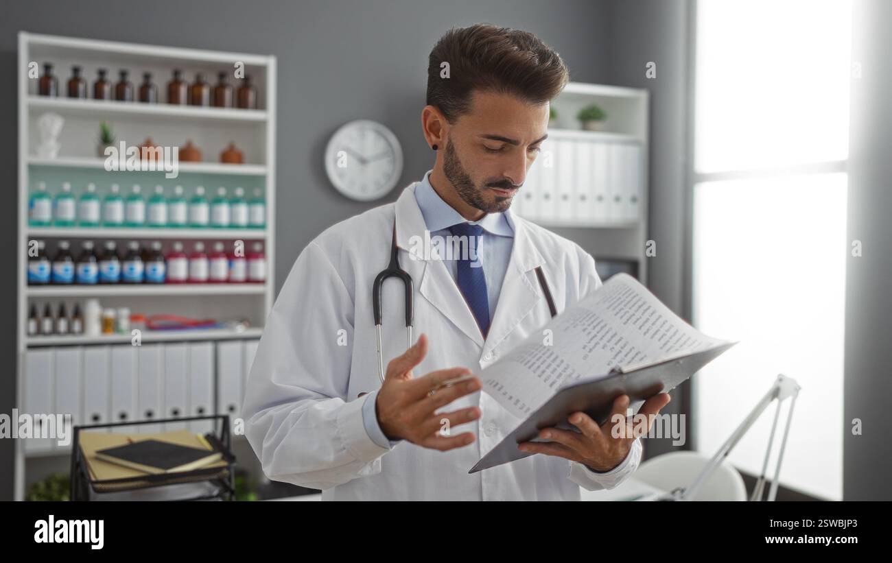 Hispanic male doctor analyzes patient files in a well-organized clinic ...