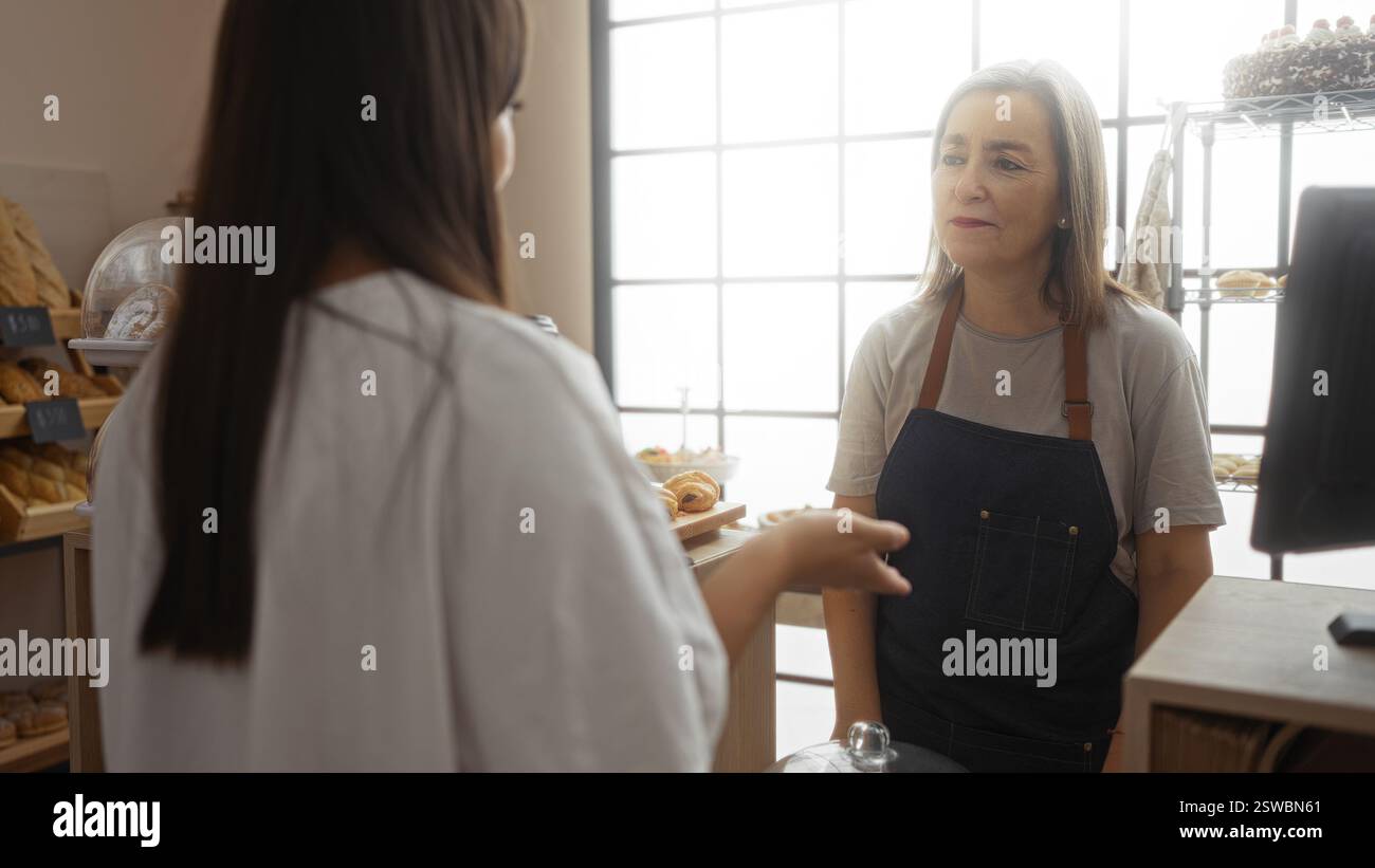Customer talking baker counter hi-res stock photography and images - Alamy