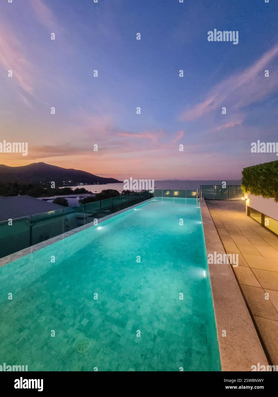 Evening tranquility by the infinity pool in Thailand Stock Photo - Alamy