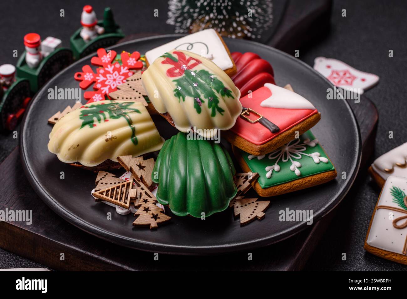 Sweet madeleine sponge cookies covered with colored chocolate Stock ...