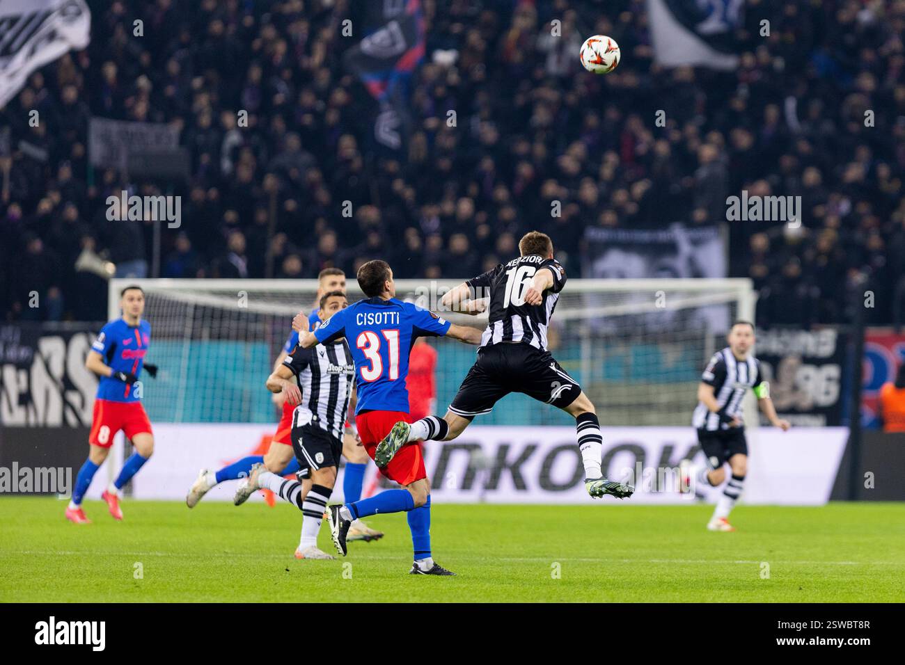Tomasz Kedziora of PAOK FC and Juri Cisotti of FCSB in action during ...