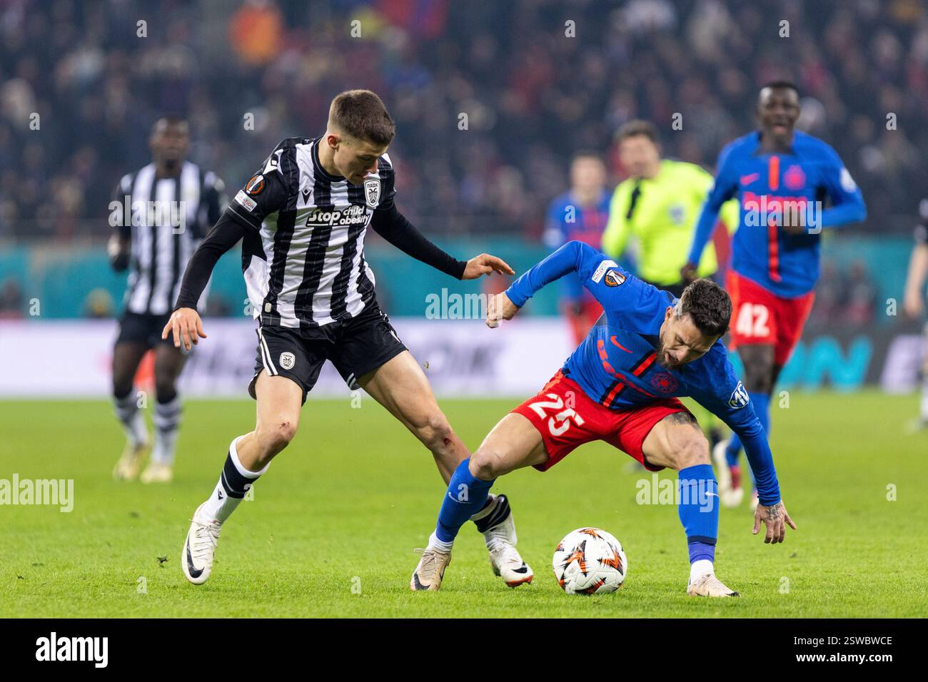 Giannis Konstantelias of PAOK FC and Alexandru Baluta of FCSB in action ...