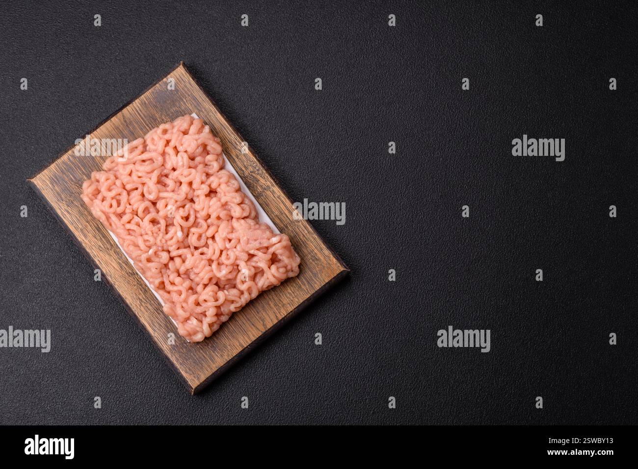 Raw minced chicken with salt, spices and herbs Stock Photo - Alamy