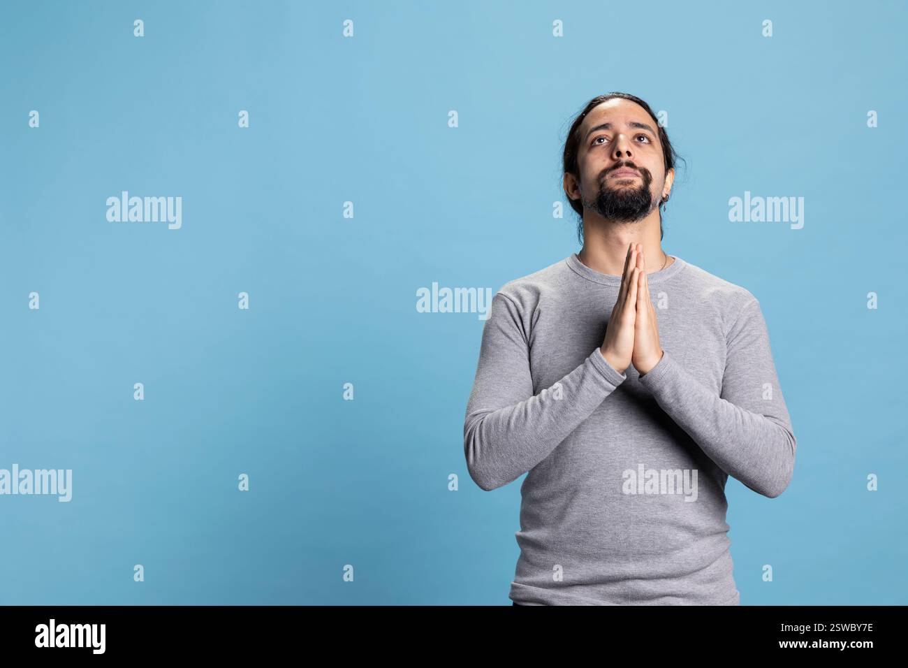 Religious person praying and begging for forgiveness in front of camera ...