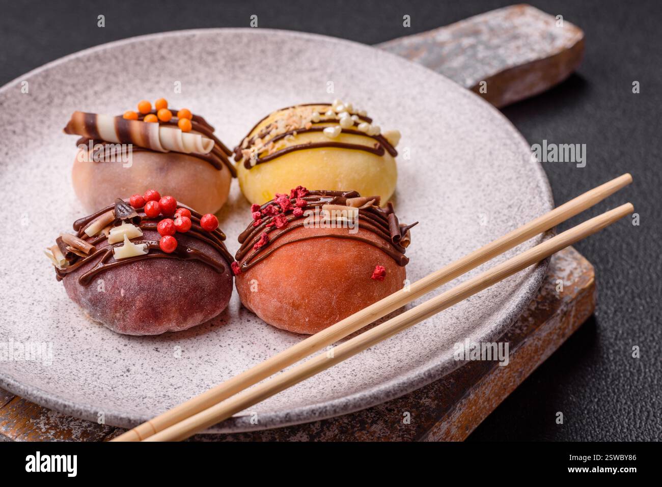 Delicious colorful asian mochi sweets with rice dough shell and fruit ...